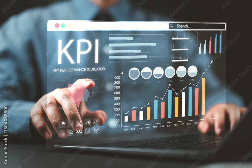 Businessman using digital screen to analyze key performance indicators ...