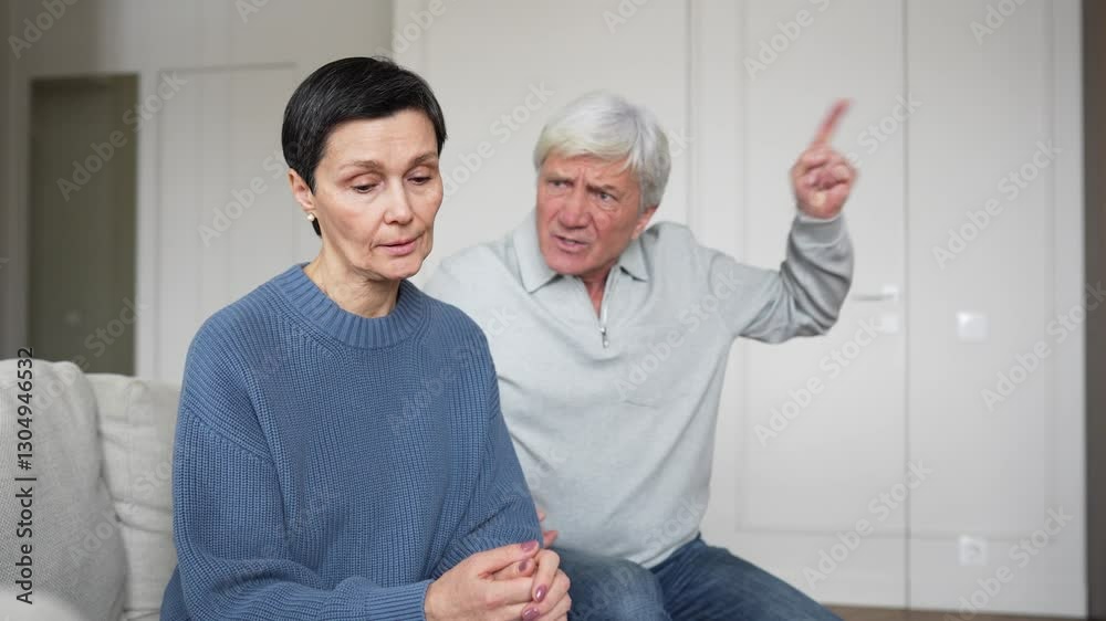 Angry furious abusive husband yelling, gesturing aggressively at scared ...