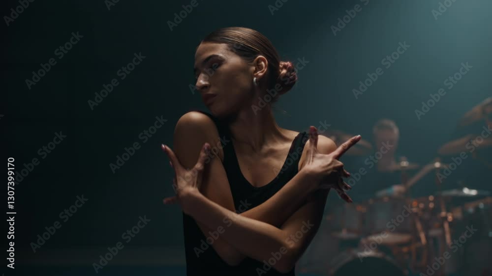 Female grace and beauty, portrait of dancing ballerina in darkness ...