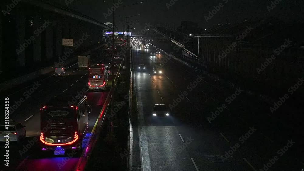 Night scene on a toll road in Jakarta as cars drive underneath, Busy ...