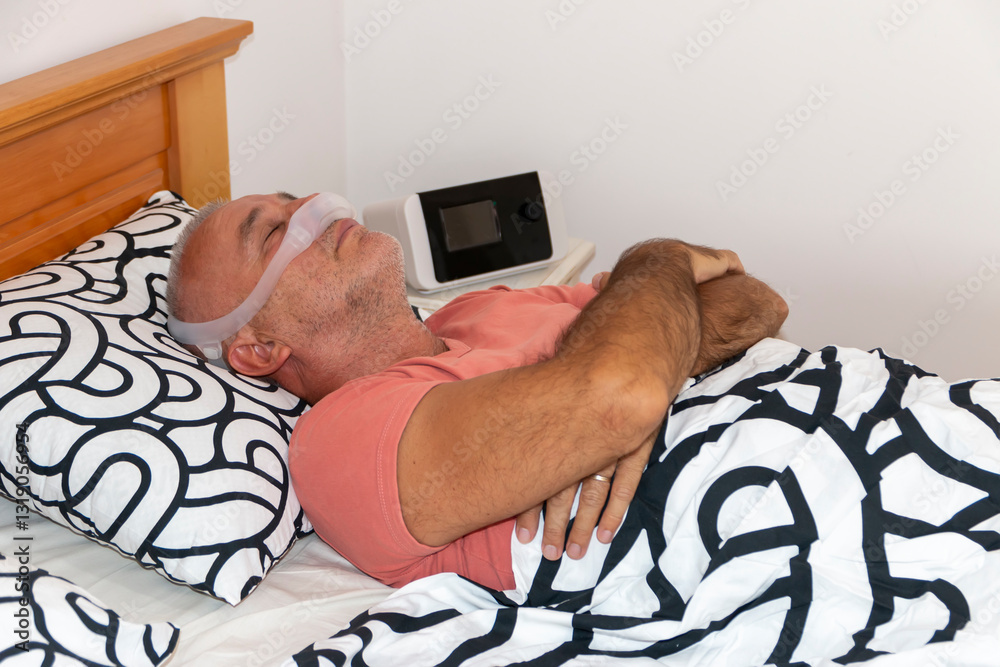 Poster A healthy mature man wearing CPAP mask sleeping smoothly on his ...