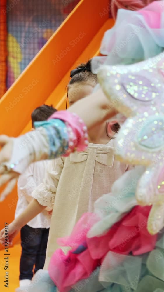 kids are having fun at birthday party in playground zone room with ...