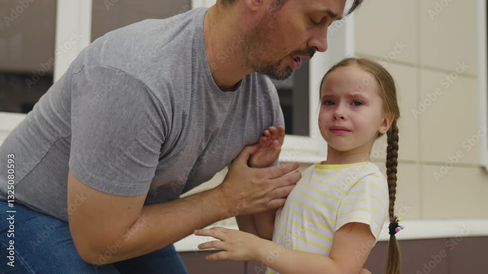 Father comforting his crying daughter, emotional moment between parent ...