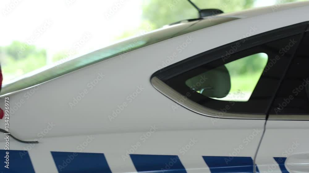 Sad young woman arrested by police officers and handcuffed sitting in ...