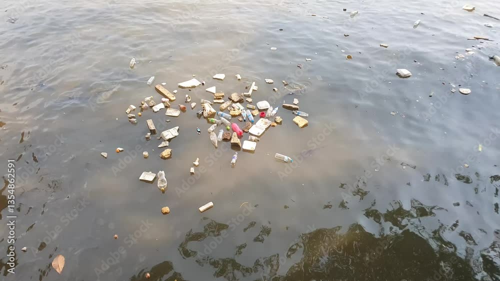 Garbage in the river, floating garbage causes water pollution. Garbage ...