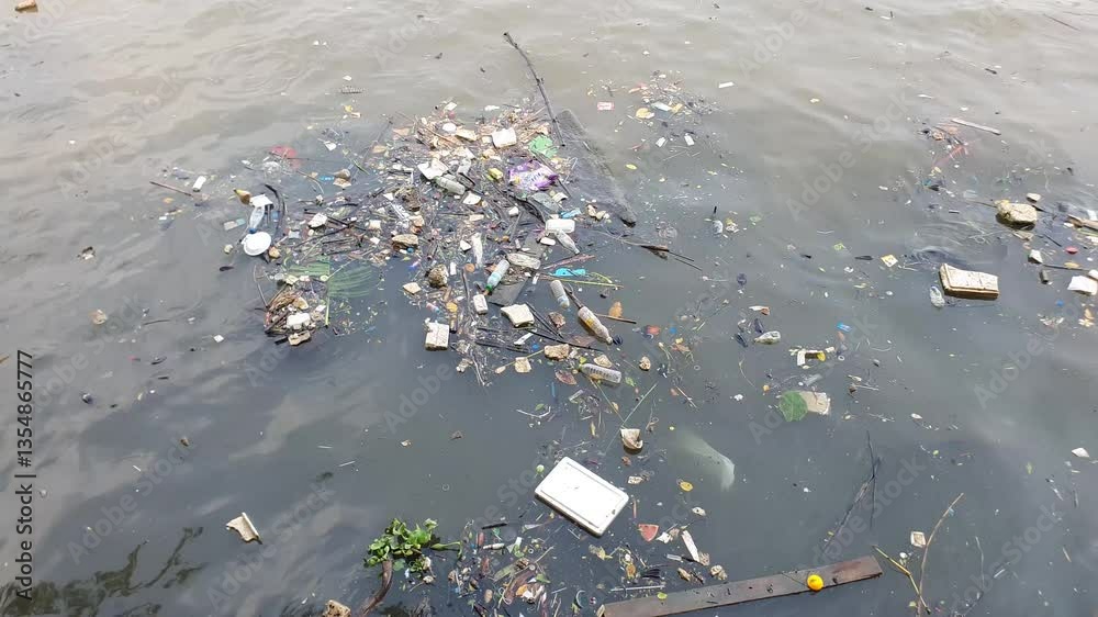 Garbage in the river, floating garbage causes water pollution. Garbage ...