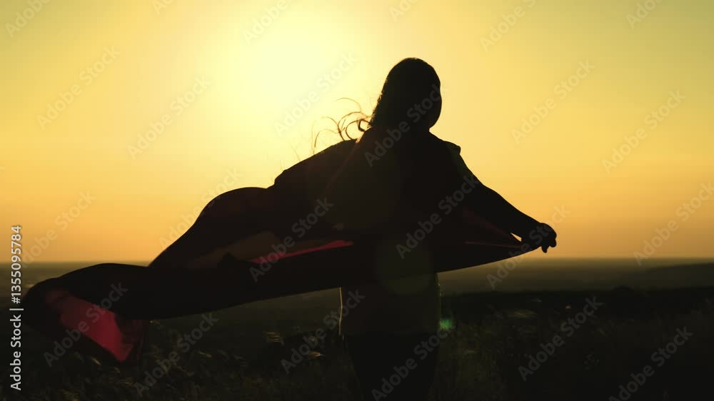 girl superhero with long hair red cape wind sunset. brave superhero ...