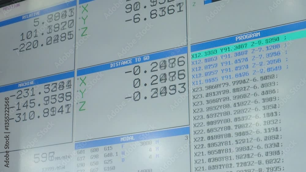Close up of a CNC machine control panel displaying real time tech ...