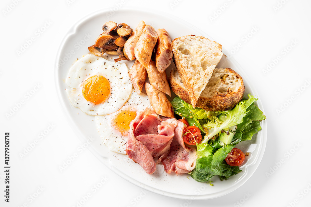 Poster A hearty breakfast platter featuring fried eggs, smoked sausage ...
