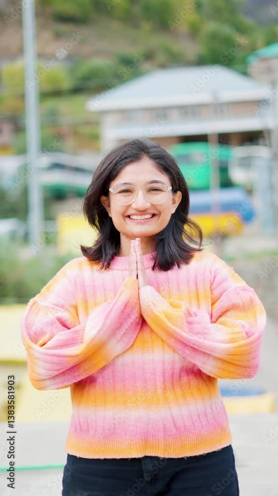4K Vertical portrait of teenager Indian girl doing Namaste with hands ...