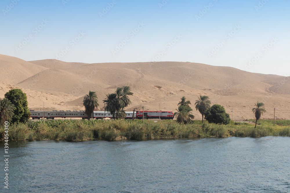 Poster Landscape of the magical blue Nile River and a train in upper ...
