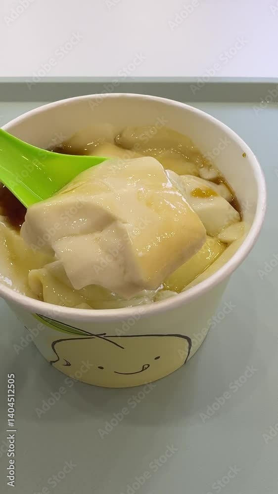 Wideo Stock: a bowl of gula melaka beancurd from Mr. Bean store at The ...
