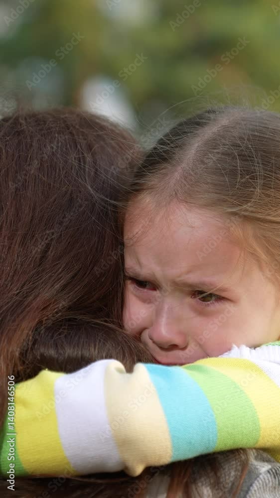 little child cries, tears child face, mother calms capricious kid girl ...