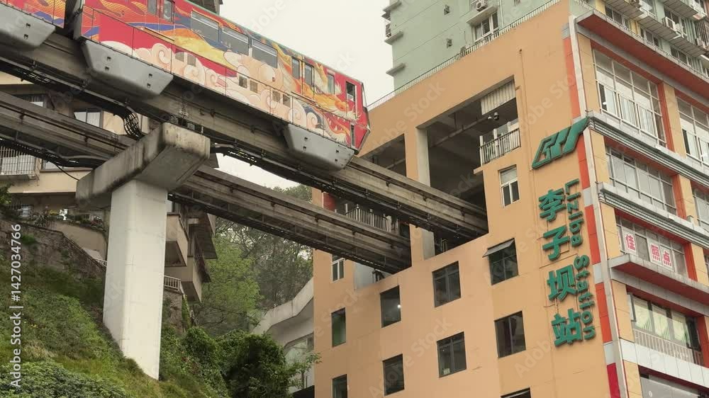 Chongqing, China - April 11, 2025: A dragon designed train entering a ...