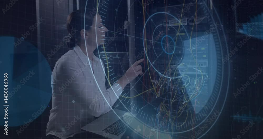 IT technician pointing network cables in data center, using HUD ...