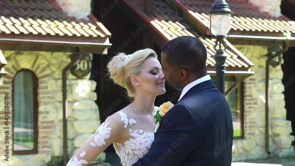Wedding couple in love. Mixed-race marriage celebration. Mixed-race ...