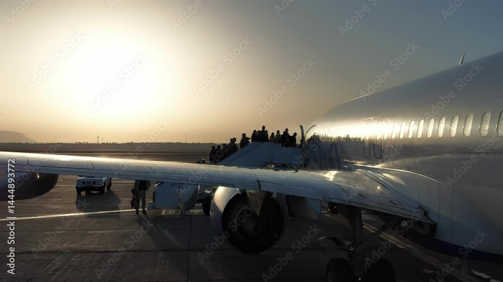 Boarding plane, people passengers stand on stair truck gangway and ...