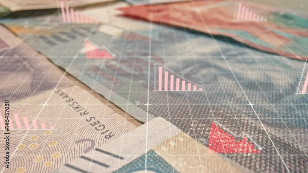 Stacked banknotes lying on surface while red declining bar graphs ...