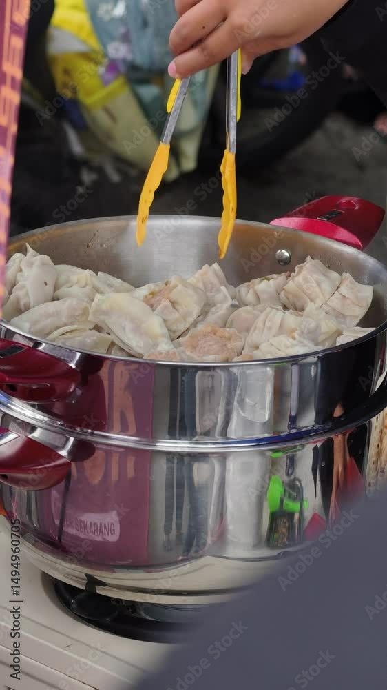 Dim sum on stainless steel steamer. Asian Street Food. Chinese dessert ...