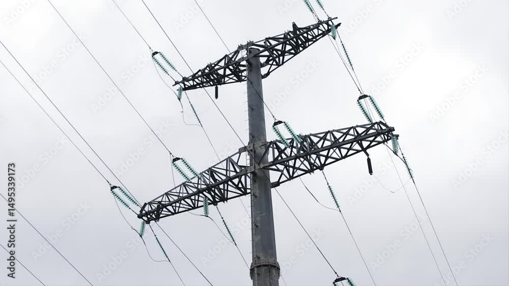 Tall metal electricity pylon supporting high-voltage power lines ...