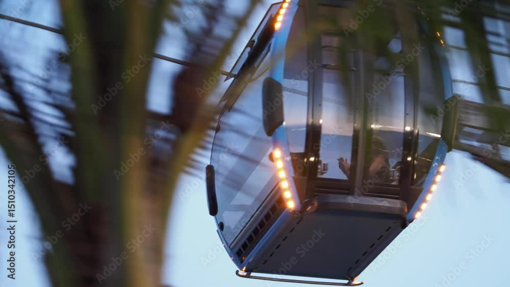 The cable car departs from the station as the camera follows its ...