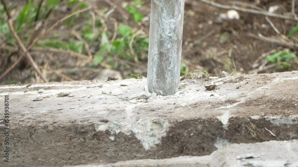 Rod concrete construction Metal rod embedded in concrete at ...