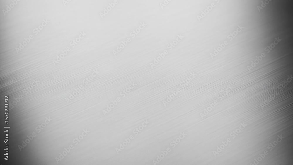 Subtle shifts in light and shadow across a textured metallic surface ...
