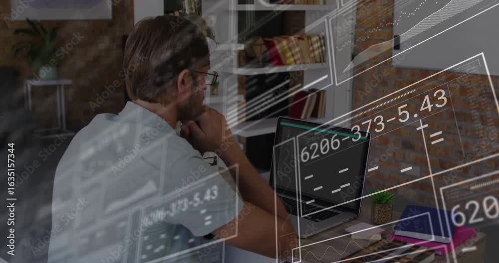 man gazing laptop screen at desk and summoning panels scrolling numeric ...