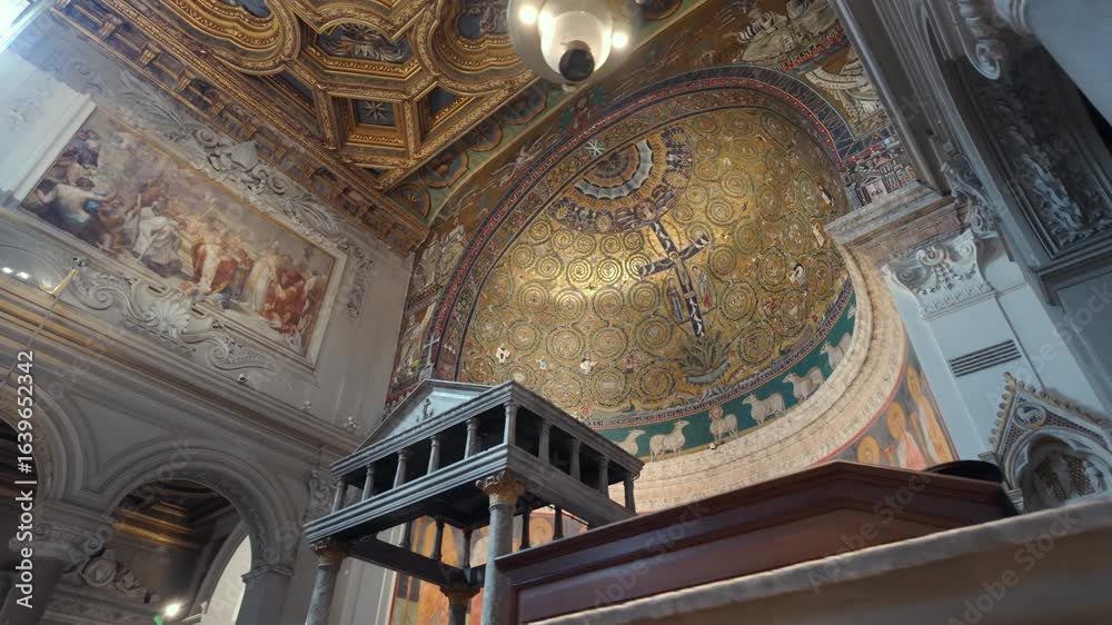 Close view of basilica apse with golden mosaic, crucifix and row of ...