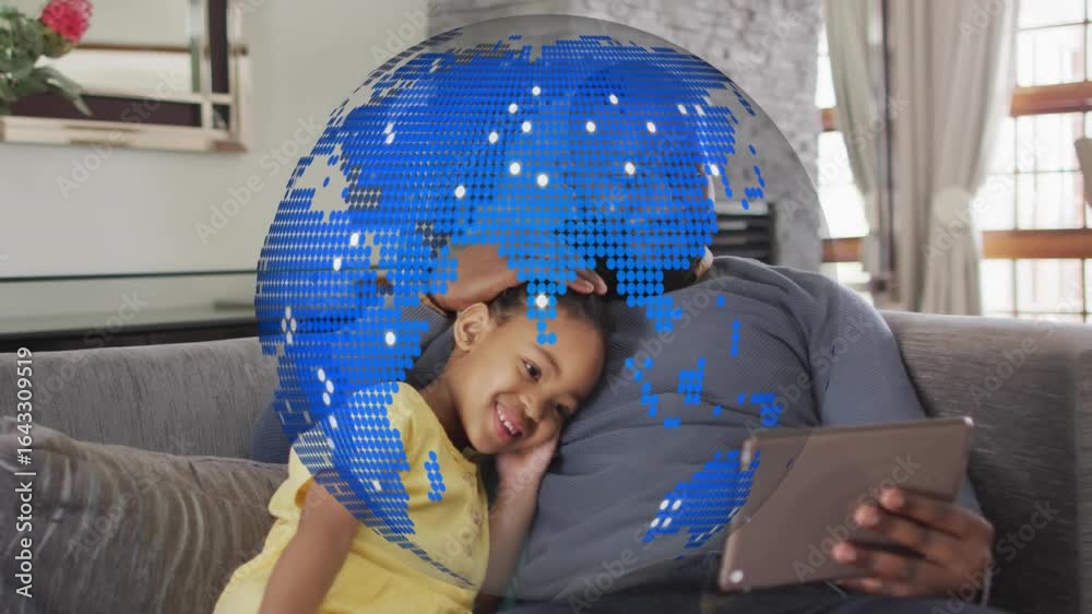 Father tapping tablet screen swiping to show daughter while transparent ...