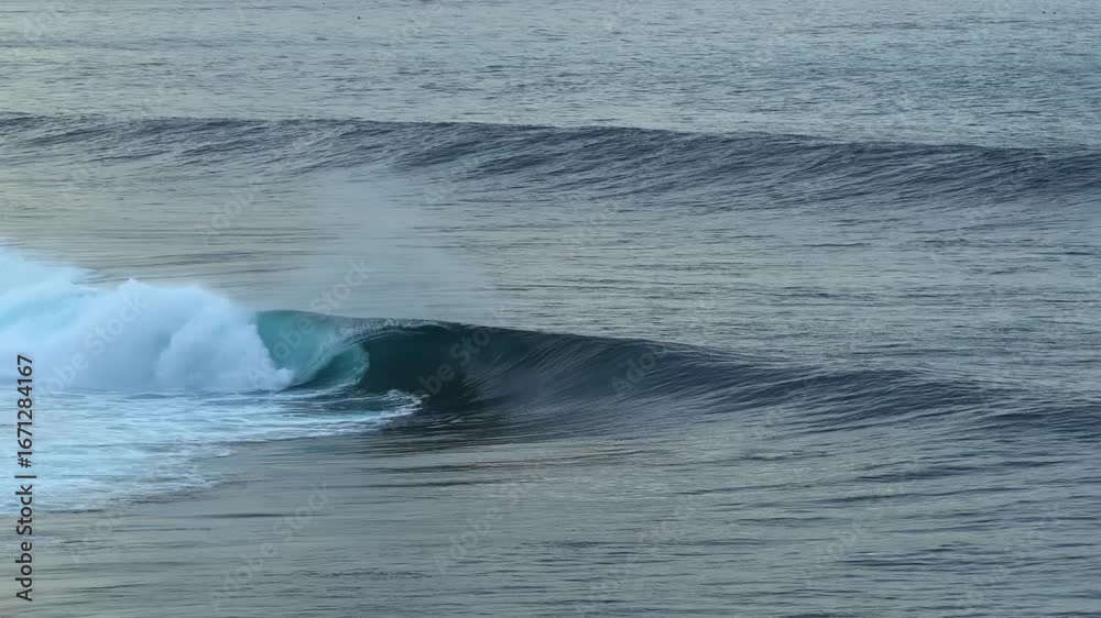 Cinematic drone footage of a grinding left-hander at Nusa Lembongan ...