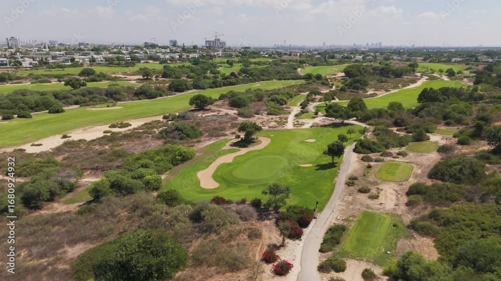 Caesarea, Israel - 25 August 2025: Aerial view of the lush green golf ...