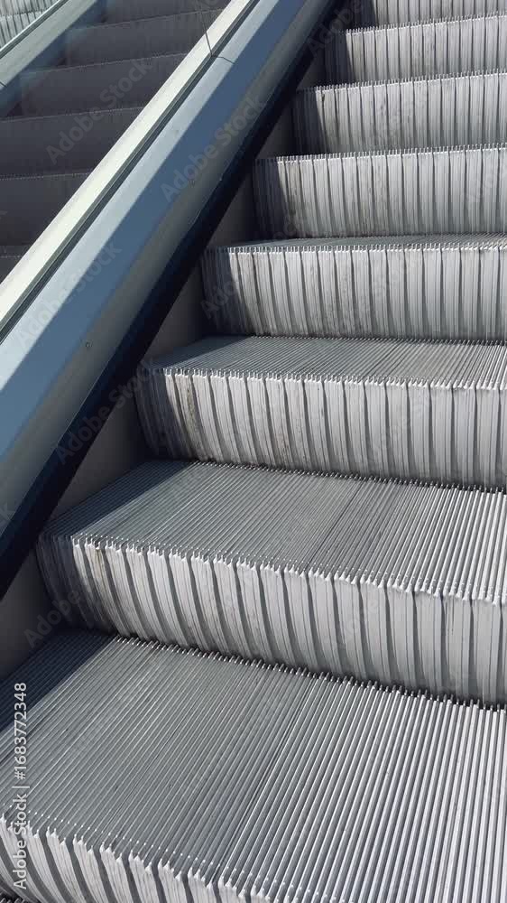 Alicante, Spain - August 30, 2025: Escalator steps in continuous motion ...