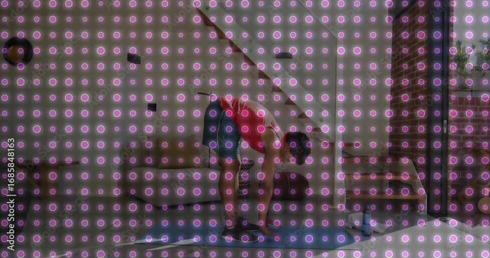 Man initiating hamstring stretch by lowering arms and hinging forward ...