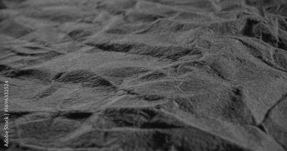 Crumpled Texture. Movement over a dark rough texture with crumpled ...