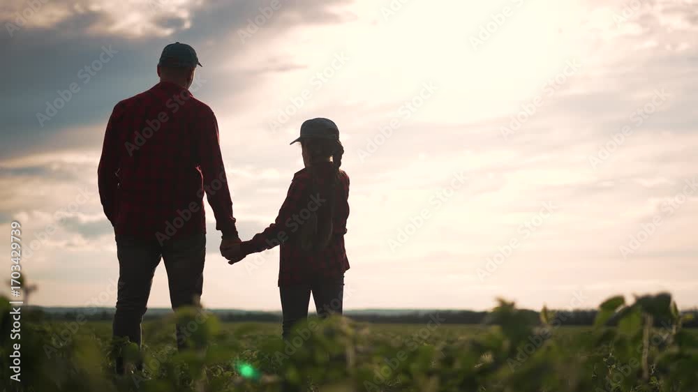 Family crop field at sunset. Father and daughter bonding over agronomy ...