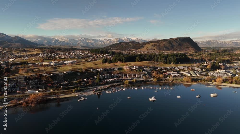 Panoramic aerial view over Wanaka resort town and its namesake lake on ...