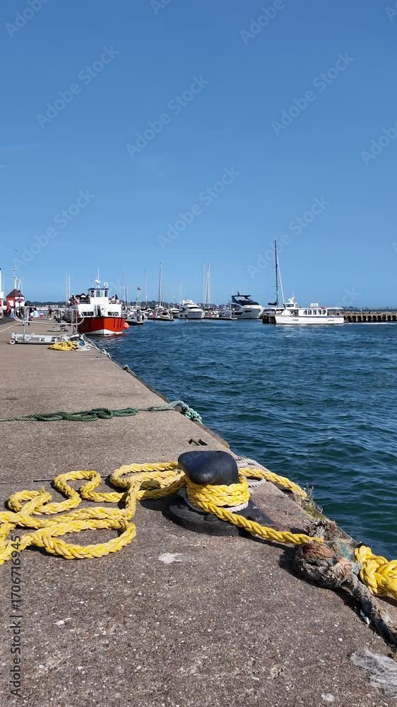 Poole Dorset England UK. 18.08.2025. Video. Poole harbour wall untidy rope and background of ...