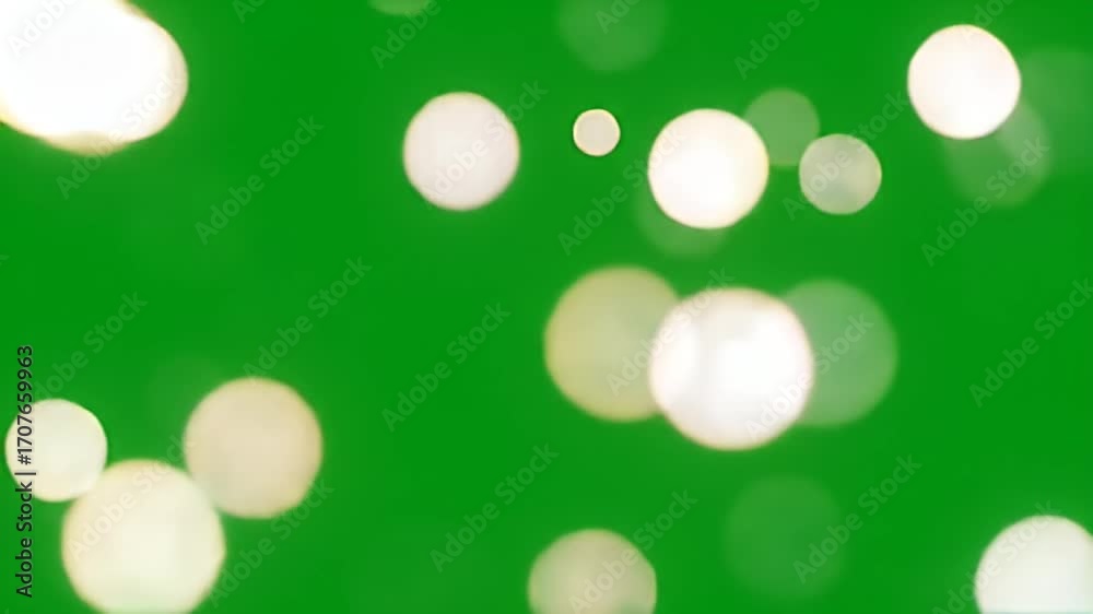 Sparkling bokeh light particles floating on green screen chroma key ...