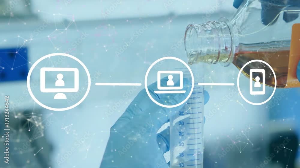 lab technician pouring amber liquid into cylinder causing PC laptop ...