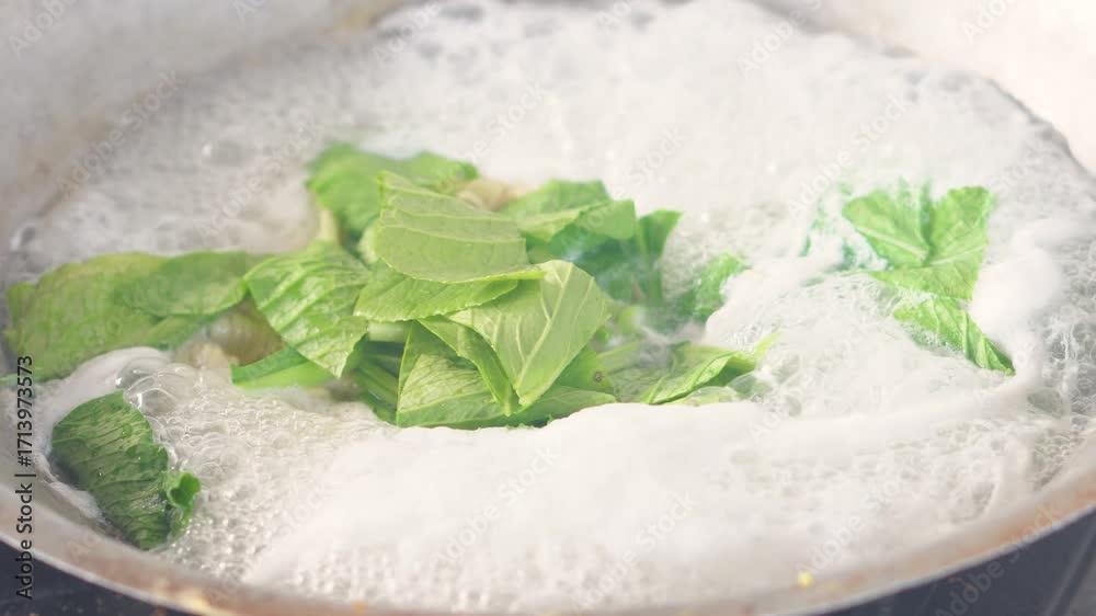 Instant noodles cooked with fresh mustard greens, creating a simple and ...