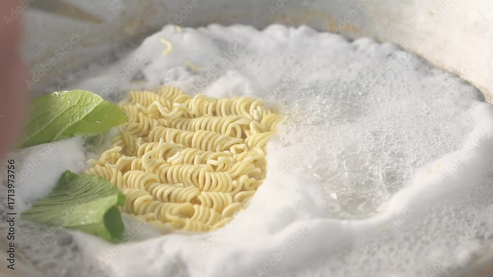 Instant noodles cooked with fresh mustard greens, creating a simple and ...
