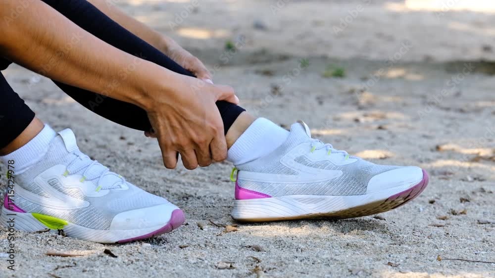 Young adult woman with muscle pain while running. A runner has a sore ...