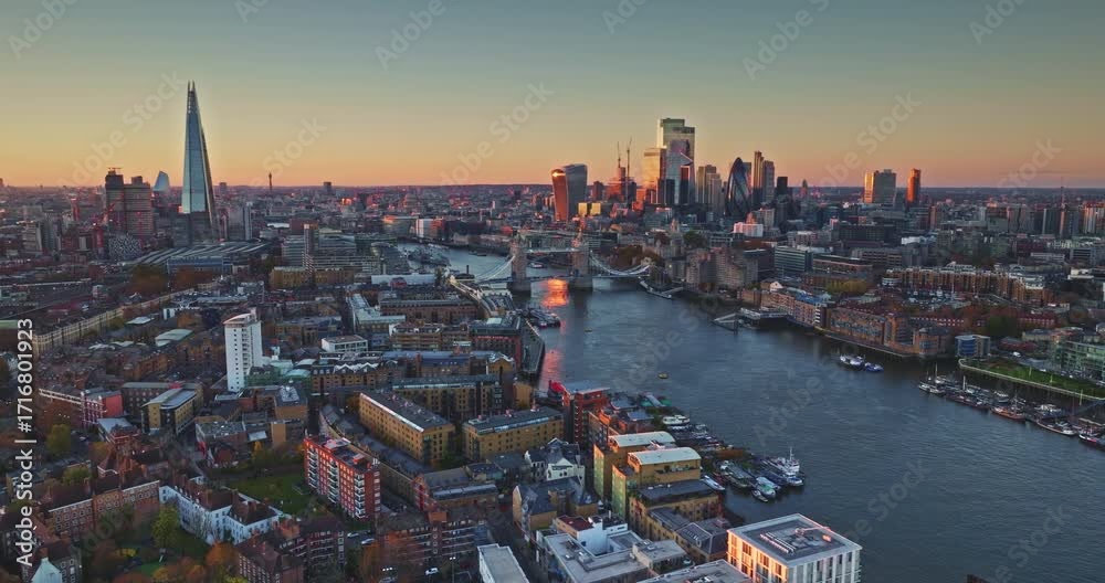 England, London: bright sunset colors reflecting on River Thames, Tower ...