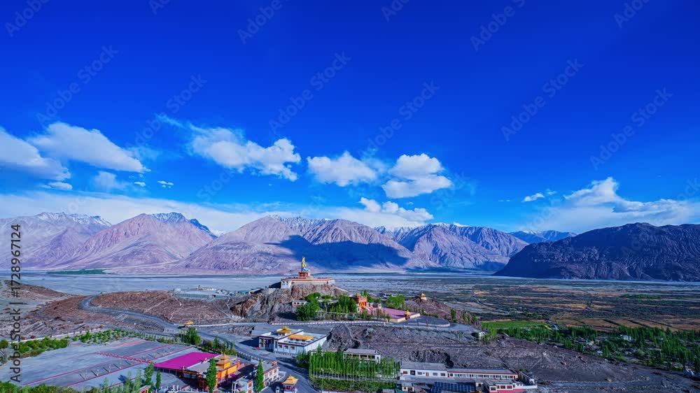 The sacred Diskit Monastery statue stands tall on a mountaintop in the ...