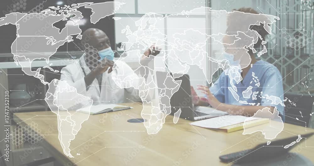 Nurse pointing at laptop and launching world map with network overlay ...