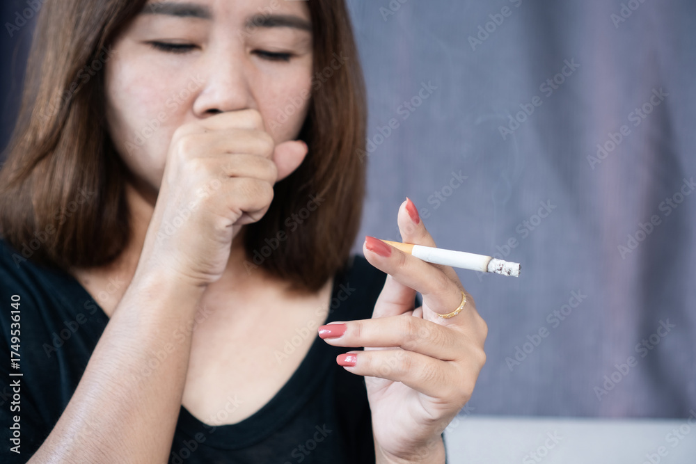 Poster Asian woman coughing from cigarette smoke, showing the health ...