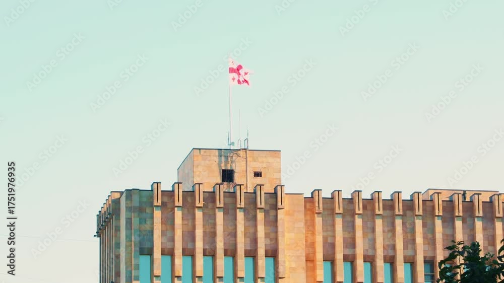 Modern Georgian government building with national flag flying proudly ...