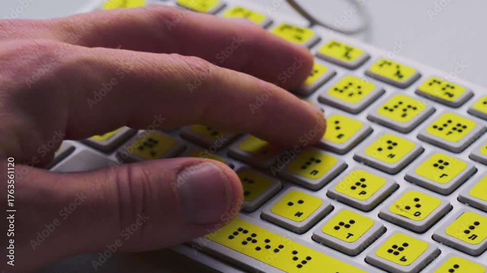 Blind person man hands using computer braille keyboard or terminal a ...