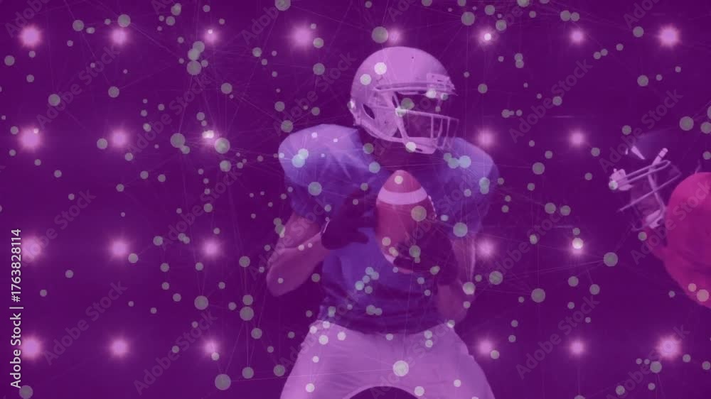Quarterback scanning for opening in sports tech backdrop while defender ...